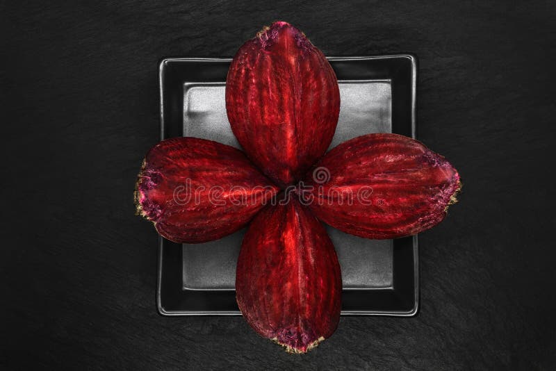 Abstract Composition of Four Pieces Chopped Beetroot Placed on Black ...