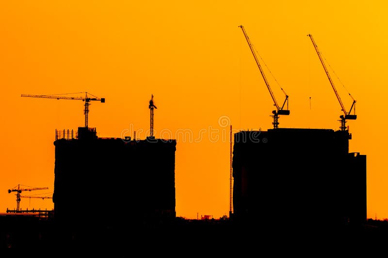 Abstract Construction Cranes and Building Silhouettes Over Sun at ...