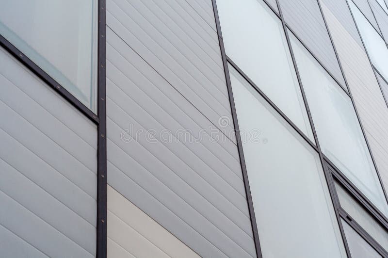 Abstract Diagonal Building Facade with Windows and Siding Background ...