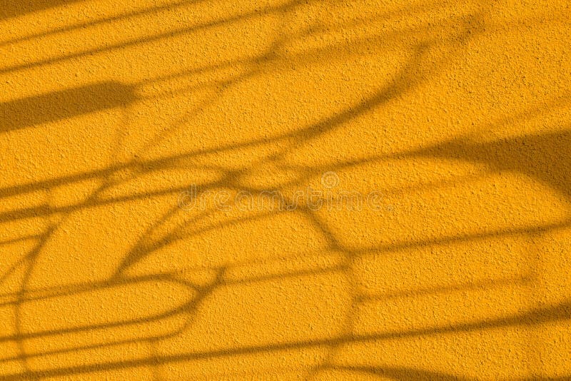 Shadow and Light on Solid Yellow Wall Texture Background Stock Photo ...