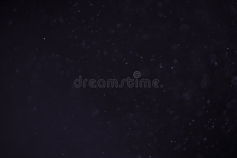 Dust Particles Fast Moving Over Black Background from Right Stock Photo ...