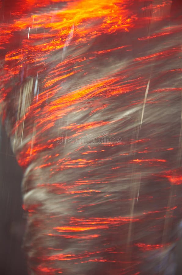 Abstract Fire and Ice of Water Swirling in a Tube of Blurry Vision ...
