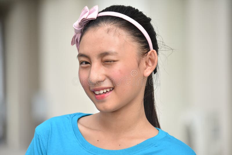 A Winking Diverse Girl stock image. Image of wink, diversity - 174577135