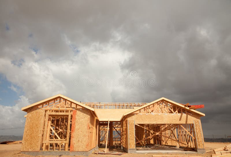 Abstract Home Construction Site and Ominous Clouds Stock Image - Image ...