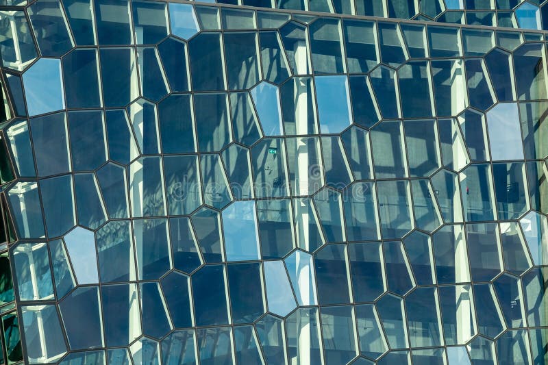 Abstract Honeycomb Glass Facade with Reflective Patterns on Modern ...