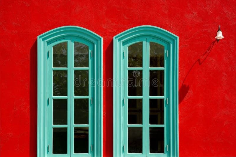 Abstract Image of Green Windows on Red Wall.Green Windows on Red Wall ...