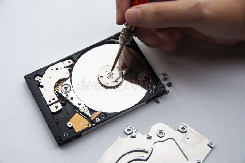 The Abstract Image of Inside of Hard Disk Drive with Technician Fixing ...