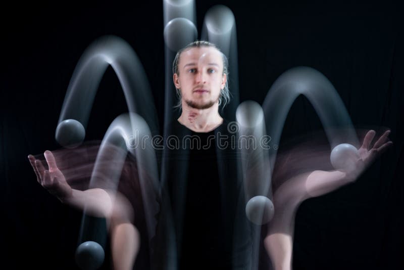 Abstract Image of Juggler with Smoothed White Balls in Motion Stock ...