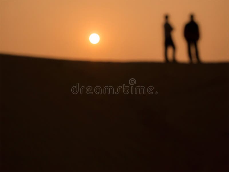 Abstract Image of 2 Men at the Desert in Sunset Time Stock Photo ...
