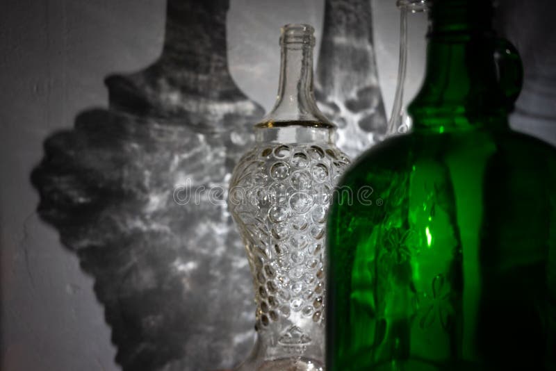 Abstract Image of Shaped Glass Bottles with a Bright Reflection on the ...