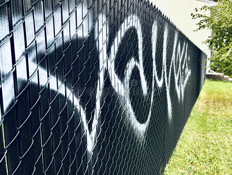 An Abstract Image of White Spraypainted Graffiti on a Fence. Stock ...