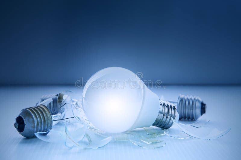 Abstract of Led Light Bulb Glowing and Lyinjg with Another Broke Stock ...