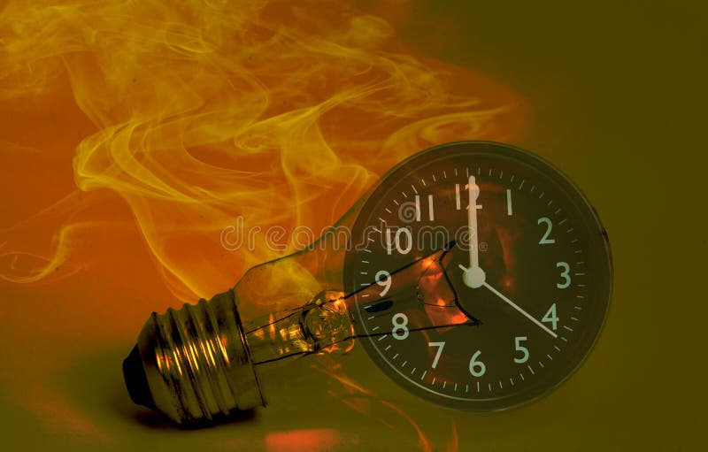Abstract a Light Bulb with Soot from Working and a Black Analog Clock ...