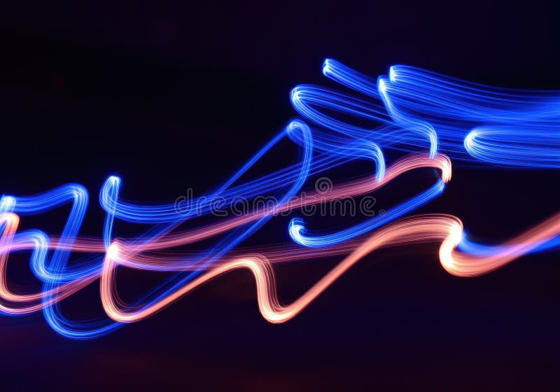 Abstract Light Trails in Blue and Orange Creating a Dynamic Visual ...