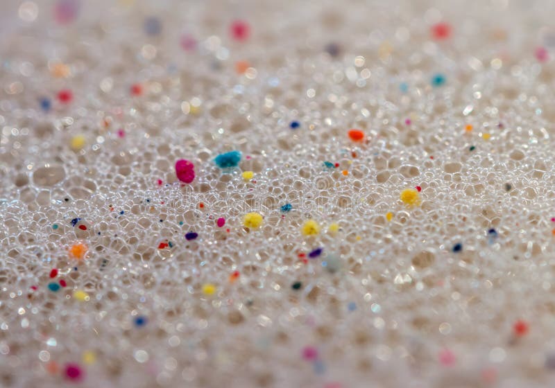 Close Up Abstract of a Bubbly Textured Surface with Colorful Spots ...