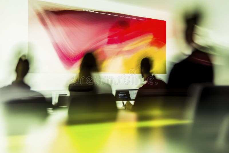 Abstract Meeting with Blurred Figures and Bright Artwork Projection in ...