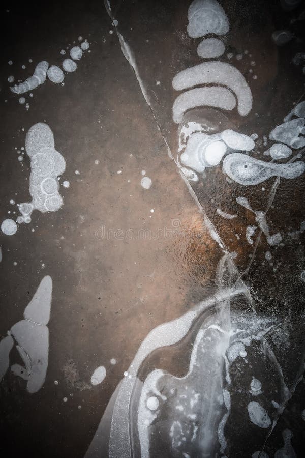 Abstract Pattern of Ice on the Over of Puddle. Toned Stock Photo ...