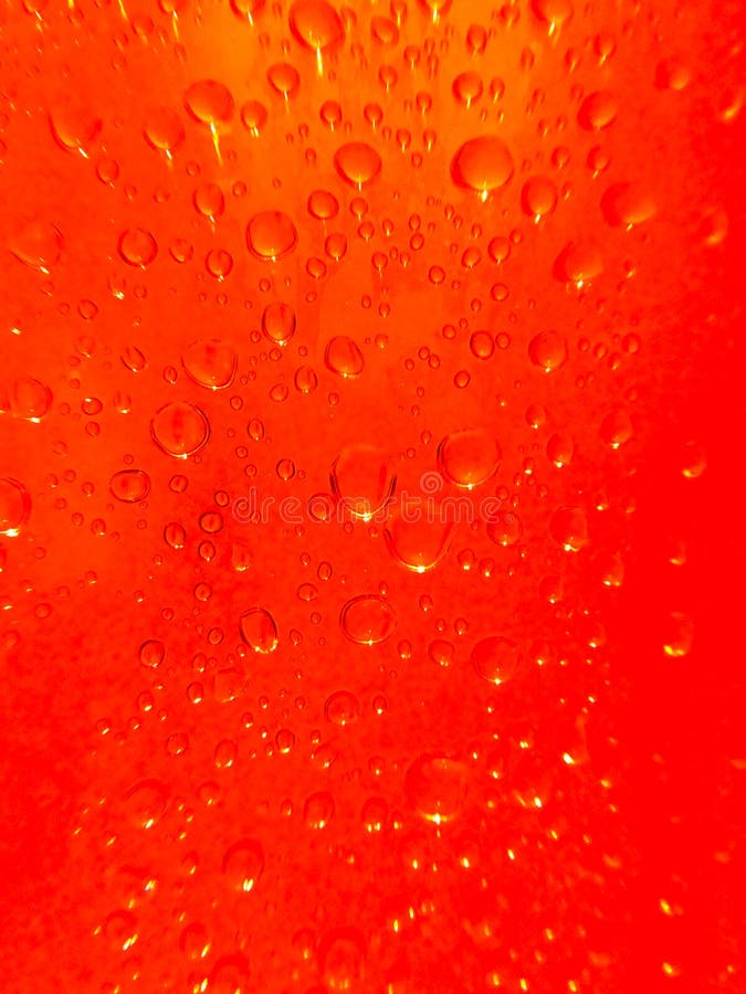 Semi-abstract Close Up of Water Droplets on a Deep Orange Background ...