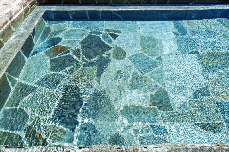 Abstract Patterns in a Pool with Natural Stone Tiles Stock Image ...