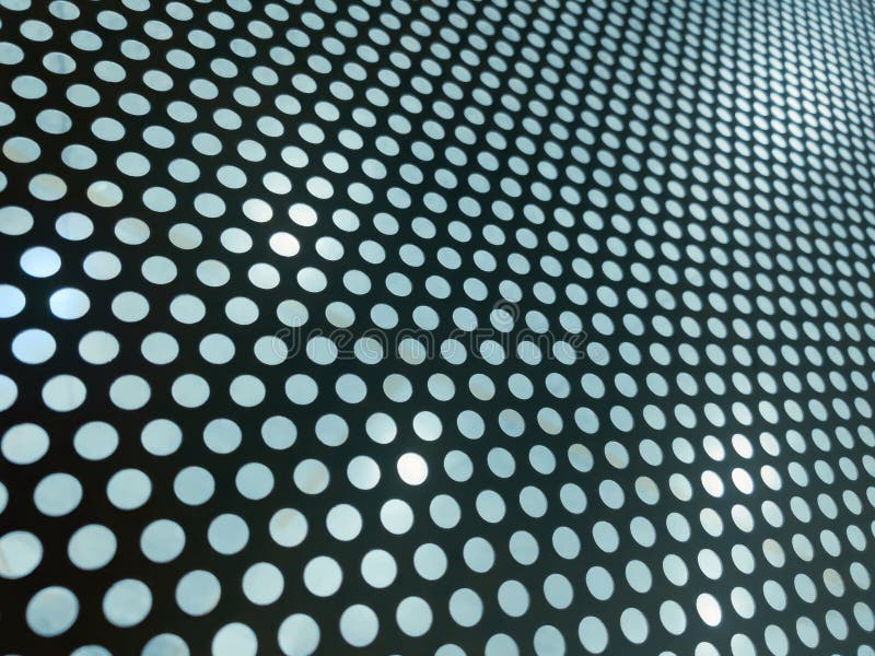 Future Tech Glow: Perforated Metal Surface Illuminated with Blue Light ...