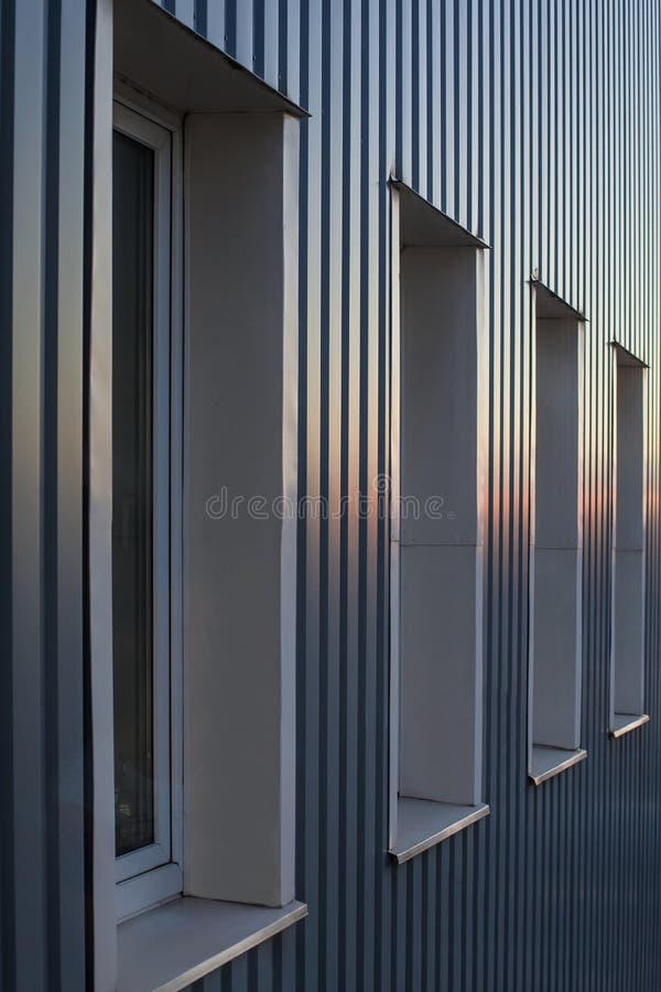 Abstract Perspective of Plastic Windows on a Metal Covered Wall Stock ...