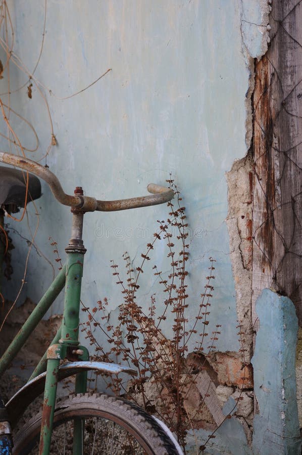 Aged Blue Wall with Falling Plaster and Broken Bicycle Stock Photo ...