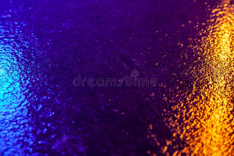 Abstract Photo Reflection of Light on a Wet Surface. Blue-yellow Neon ...