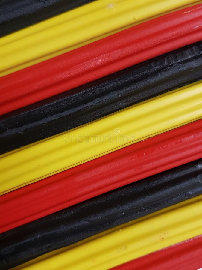 Abstract with Plasticine Bars in Black, Yellow and Red Color ...