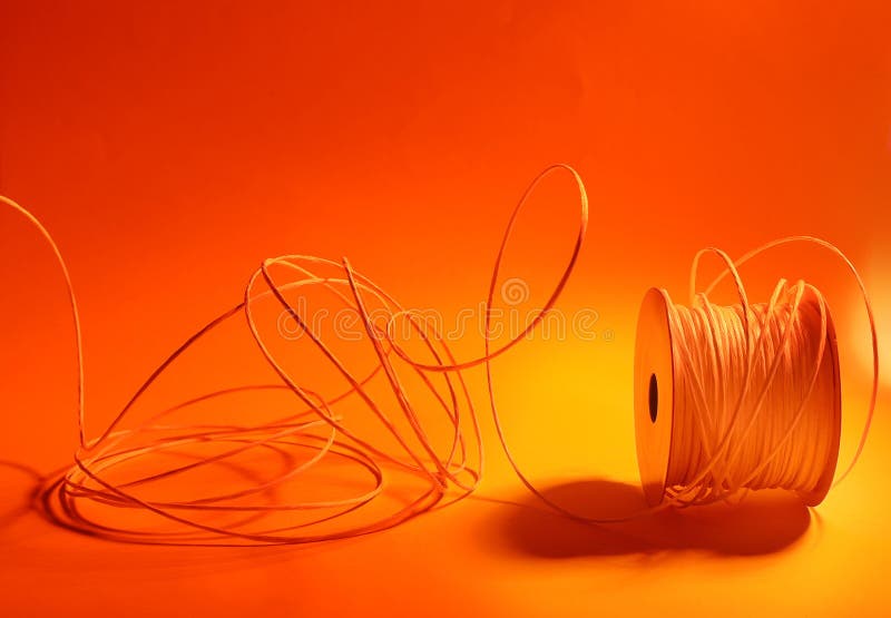 Tangled White Paper Wire with Spool on Orange Background. Stock Image ...