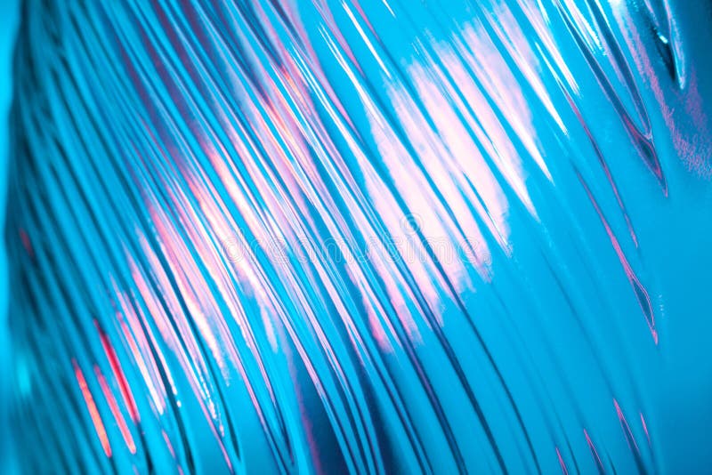 Abstract Ribbed Glass with Wavy Pattern Illuminated in Blue and Pink ...