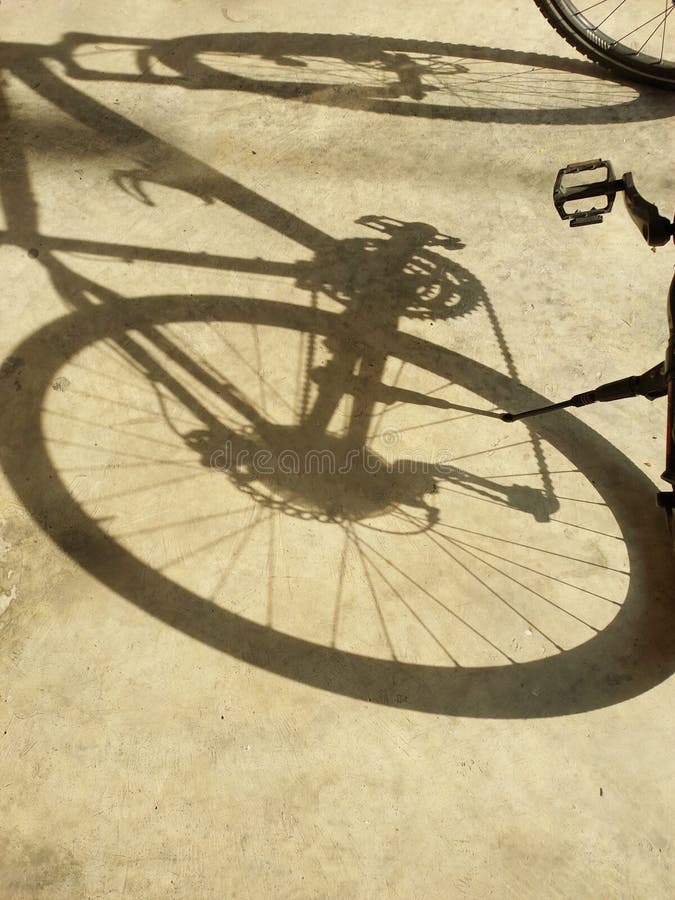 Abstract Shadow on Cement Floor. Shadow of Bicycle Part on Ground ...