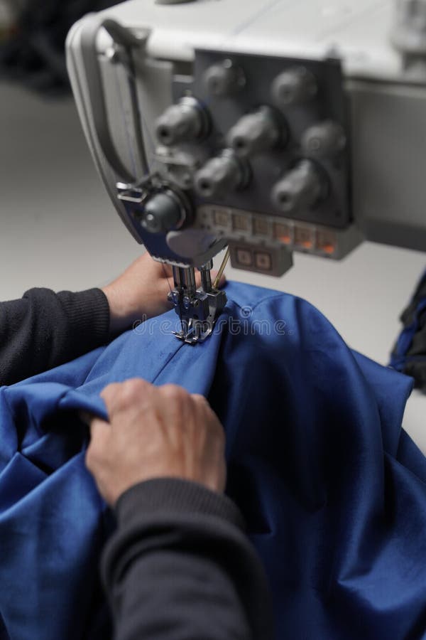 Abstract Shot of Man Sewing Blue Cloth Stock Photo - Image of machine ...