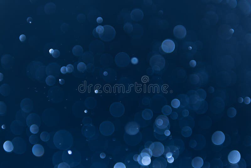 Abstract Sparkle Bokeh Light Effect with Navy Blue Background Stock ...