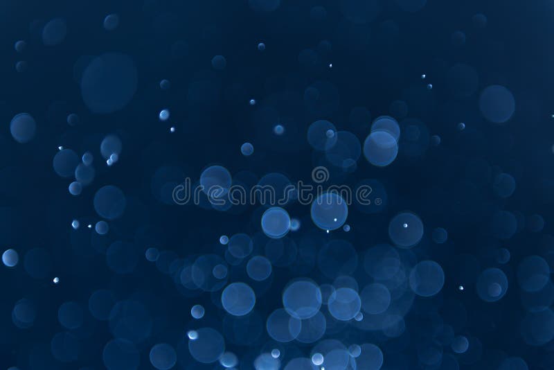 Abstract Sparkle Bokeh Light Effect with Navy Blue Background Stock ...