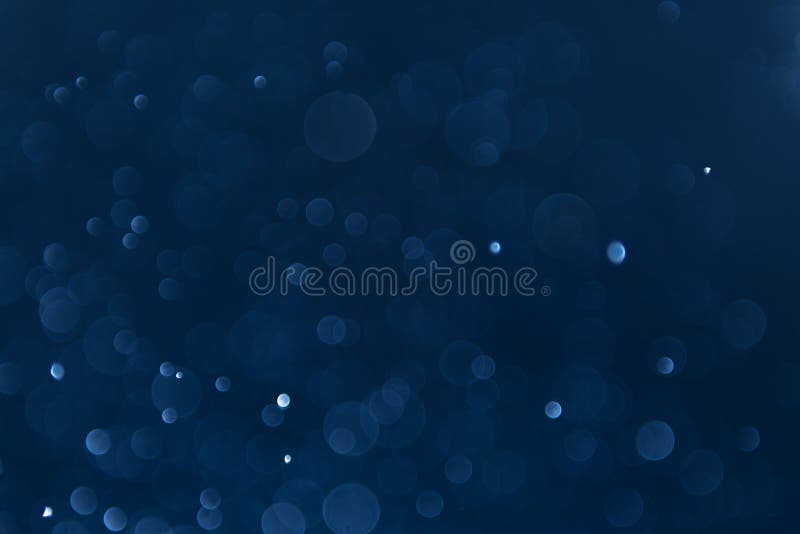 Abstract Sparkle Bokeh Light Effect with Navy Blue Background Stock ...