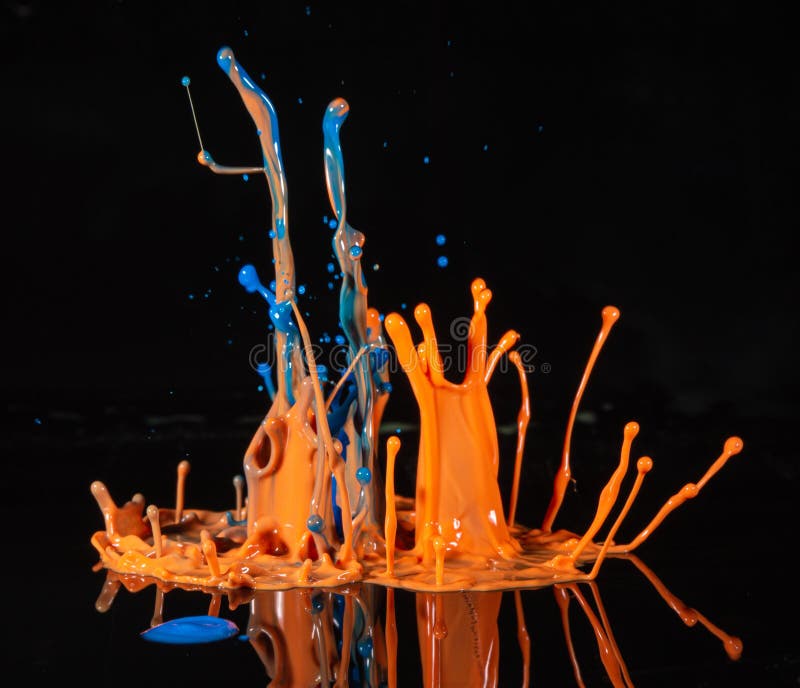 Abstract Splash of Color Ink on Black Background Stock Image - Image of ...