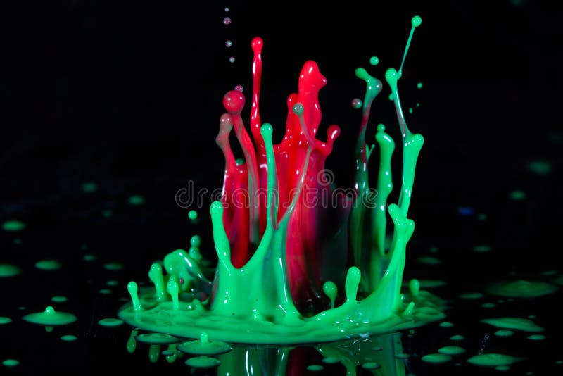 Abstract Splash of Color Ink on Black Background Stock Image - Image of ...