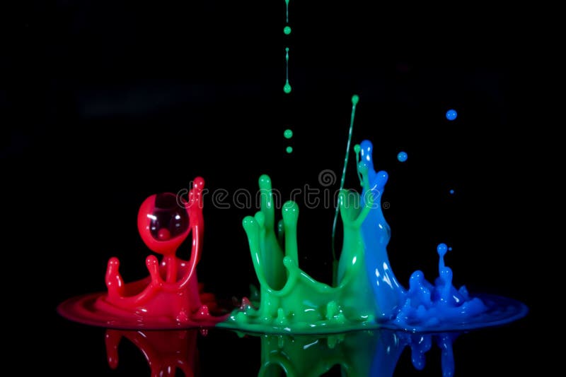 Abstract Splash of Color Ink on Black Background Stock Photo - Image of ...
