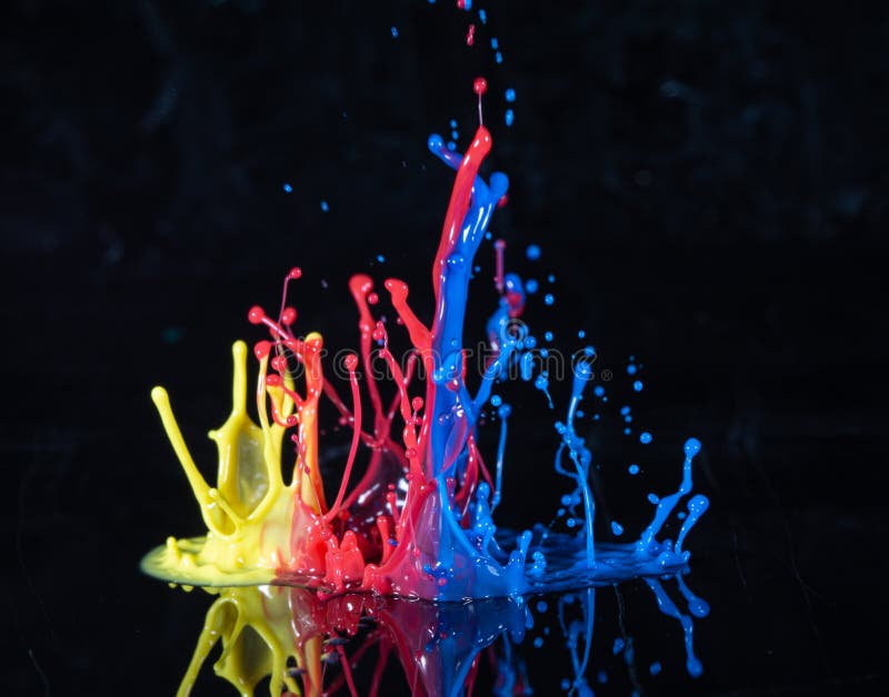 Abstract Splash of Color Ink on Black Background Stock Image - Image of ...