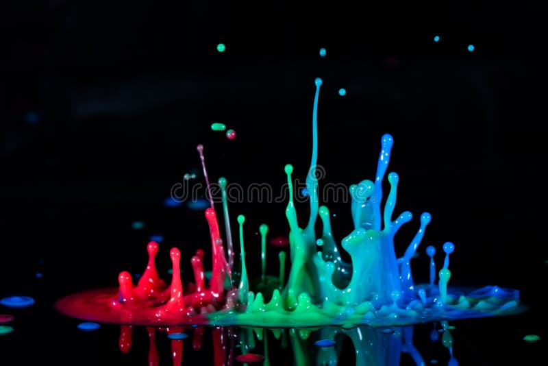 Abstract Splash of Color Ink on Black Background Stock Image - Image of ...