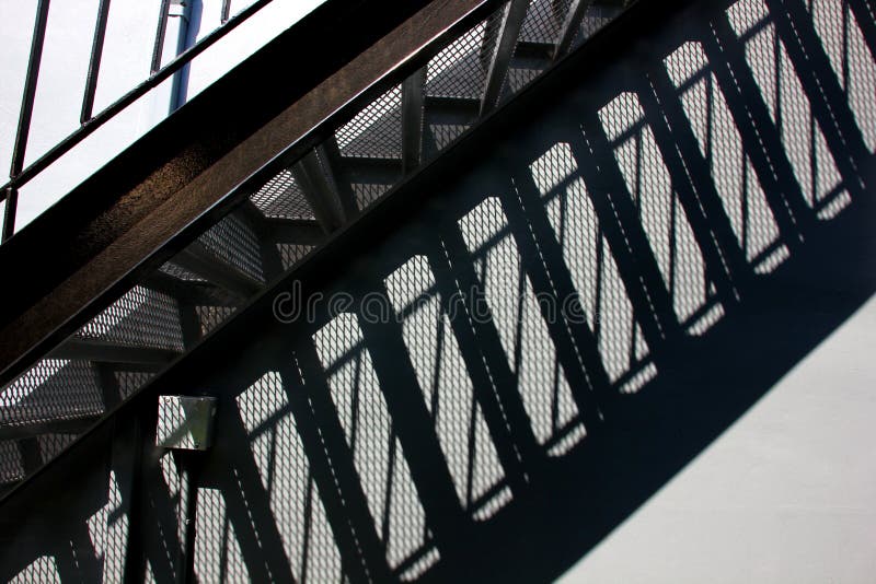 Abstract Steel Structure in Black . Iron Stairs with Shadow on the Wall ...