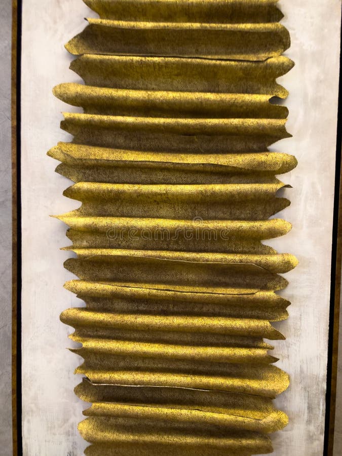 Abstract Textured Artwork with Golden Corrugated Patterns Arranged in ...