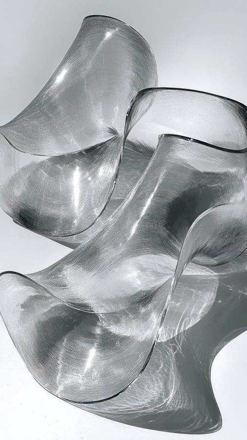 Abstract Transparent Sculpture Showcasing Fluid Forms and Light ...