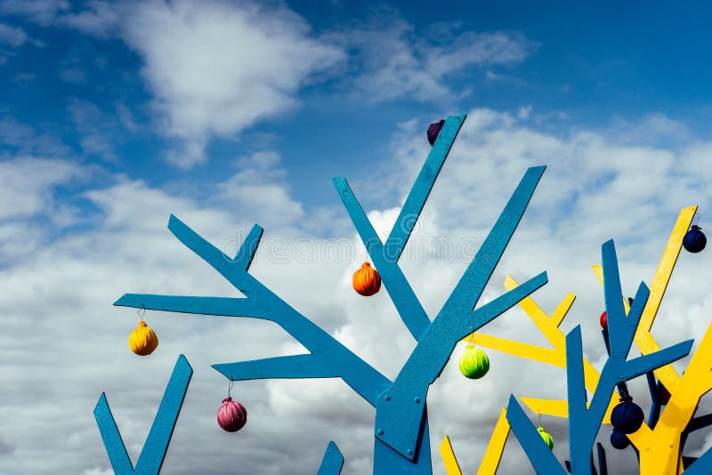 Abstract Tree Shapes Against a Blue Sky with Clouds Stock Image - Image ...