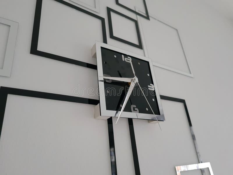 An Abstract Wall Clock on an Angle Stock Image - Image of silver, iron ...
