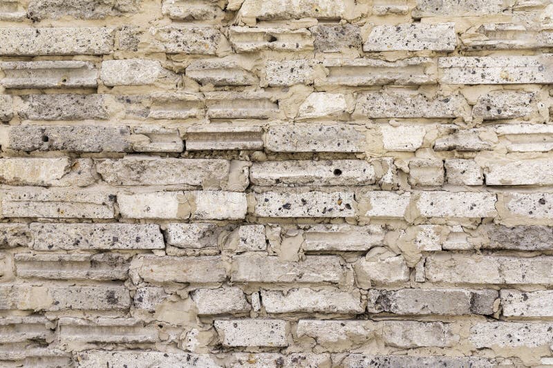 Abstract Weathered Texture of an Old Brick and Stone Wall. the Plaster ...
