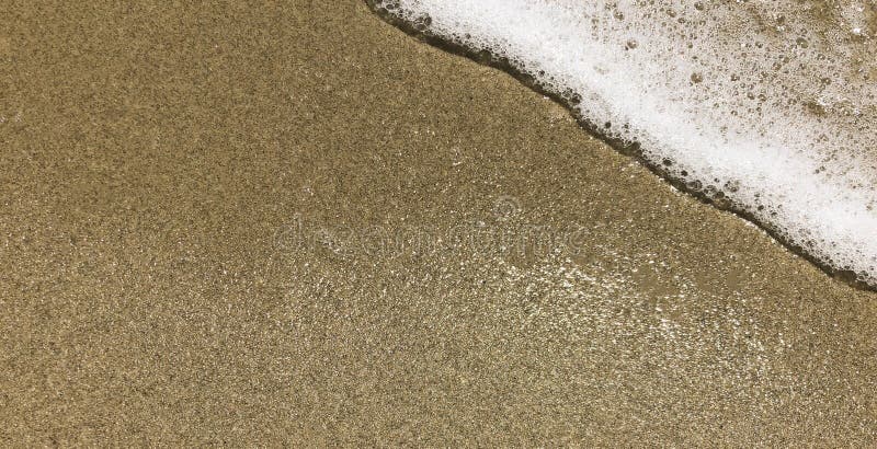 A Small Wave with Foam Rolls on the Sea Pebbles Stock Image - Image of ...