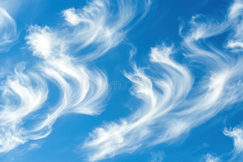 Abstract Wispy White Clouds Swirling Across a Bright Blue Sky Stock ...