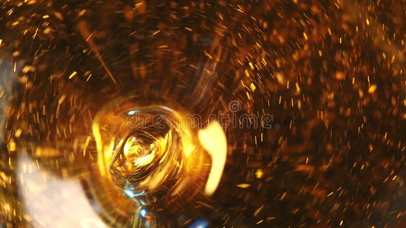 Abstraction of a Fast Swirling Whirlpool in Golden Liquid Going into ...