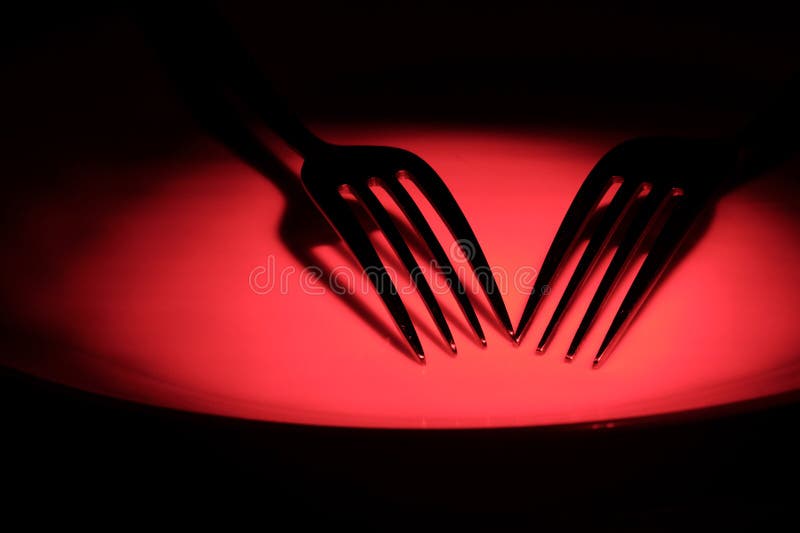 Abstraction from Table Kitchen Forks on a Plate in a Red Circle of ...
